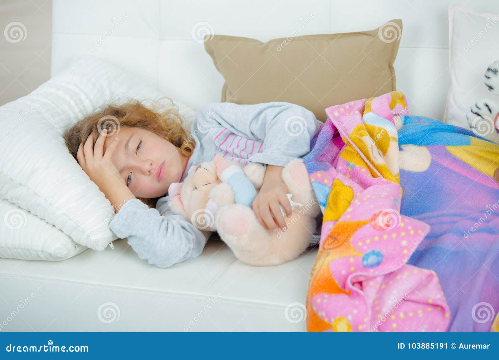 Girl lounging on sofa stock image. Image of medicine - 103885191
