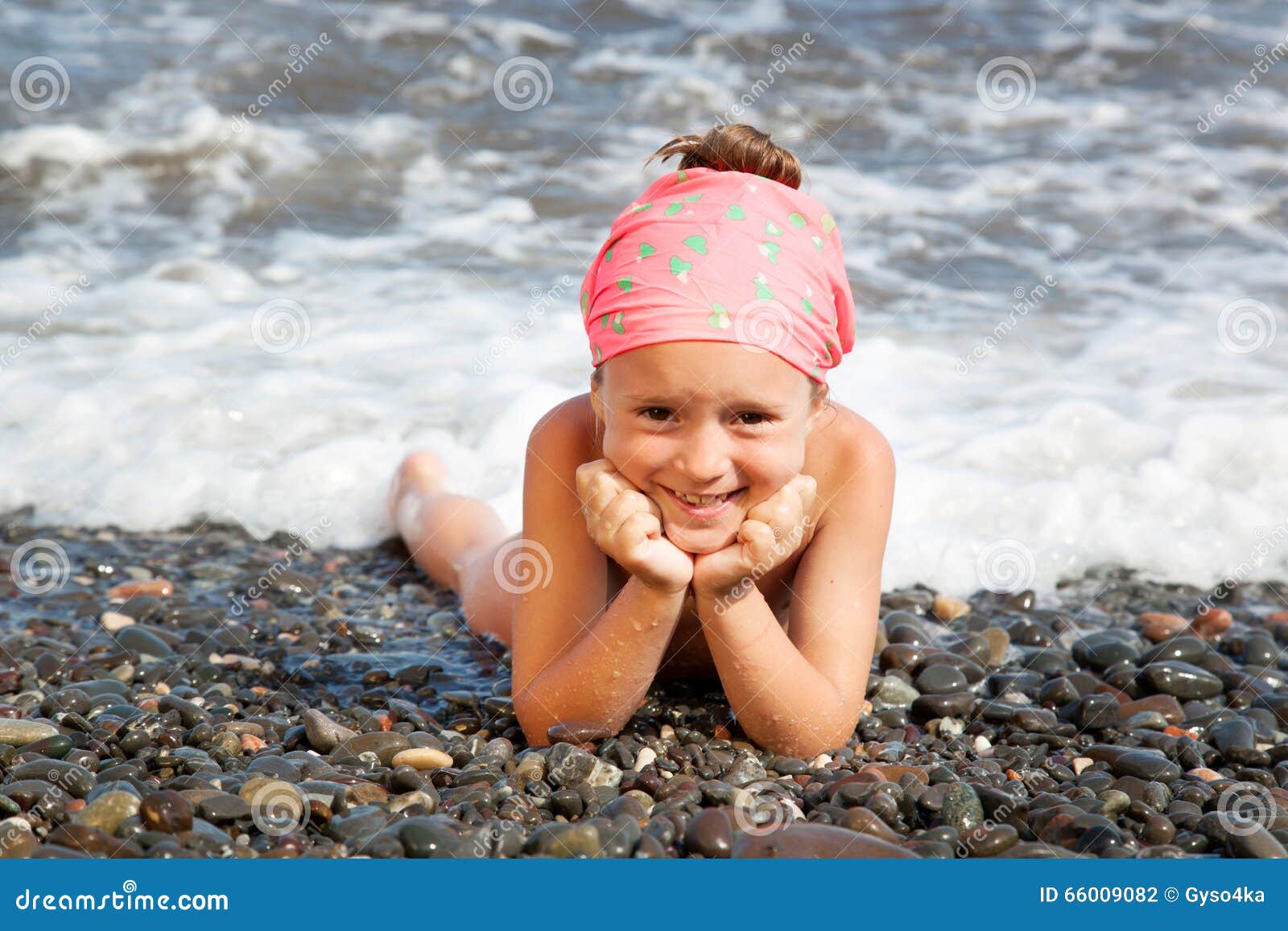Girl lying on the beach stock photo. Image of happiness - 66009082