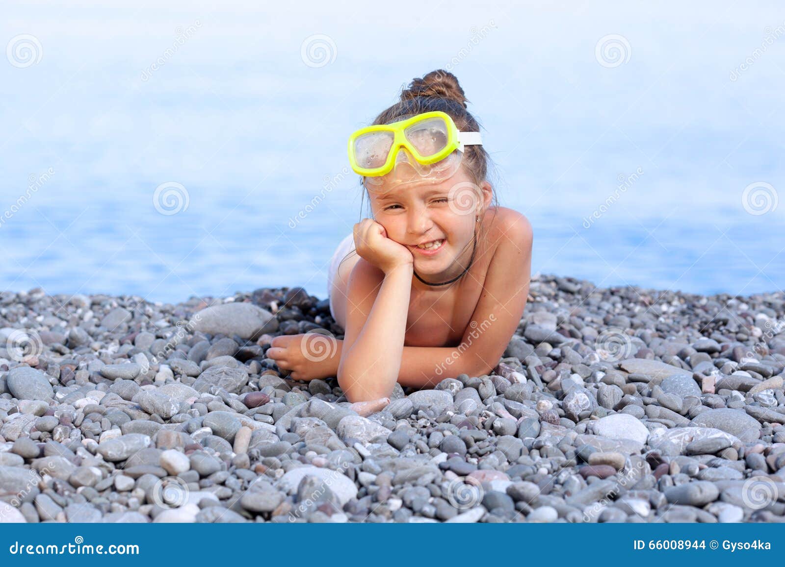 Girl lying on the beach stock photo. Image of lifestyle - 66008944