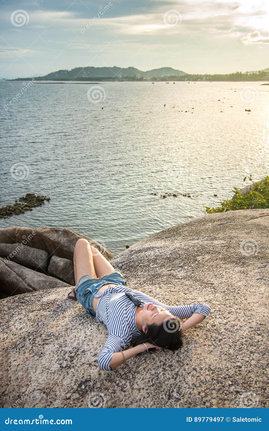 Girl Lying on the Cliff Above Seaside at Sunset Stock Image - Image of ...