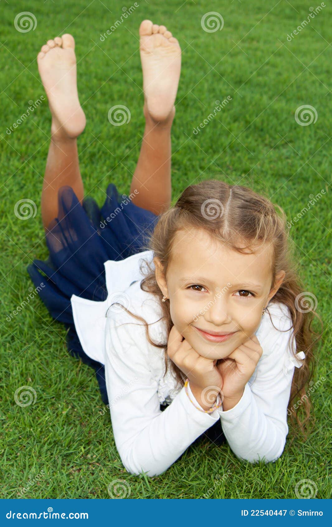 Girl lying on the lawn stock image. Image of summer, lawn - 22540447