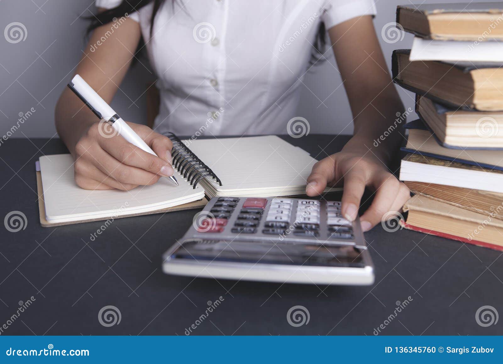 Girl makes calculations stock photo. Image of young - 136345760