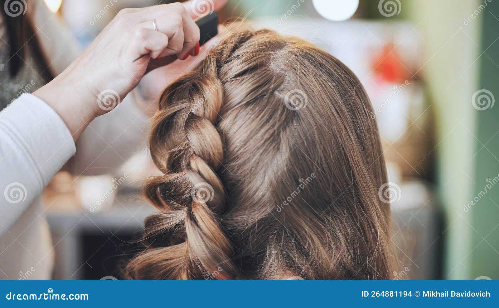 The Girl Makeup Artist Makes a Braid for the Model. Stock Photo - Image ...