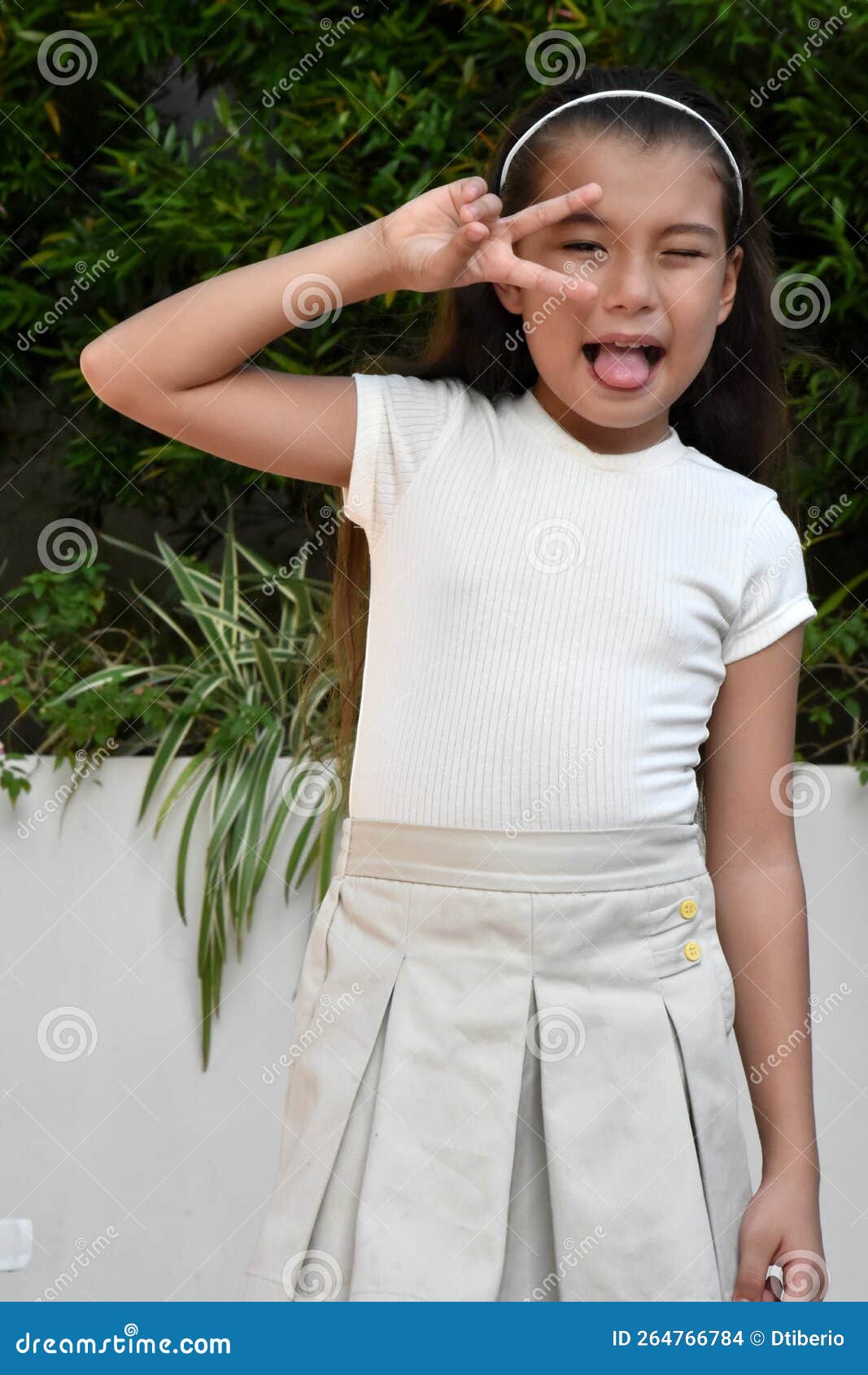 A Girl Making Funny Faces Standing Stock Photo - Image of laughter ...