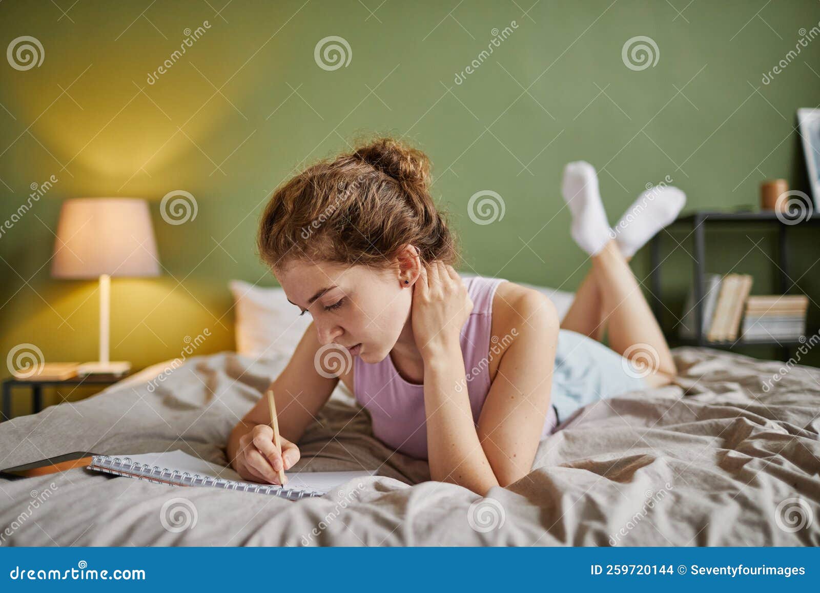 Girl Making Notes in Her Bed Stock Photo - Image of girl, young: 259720144