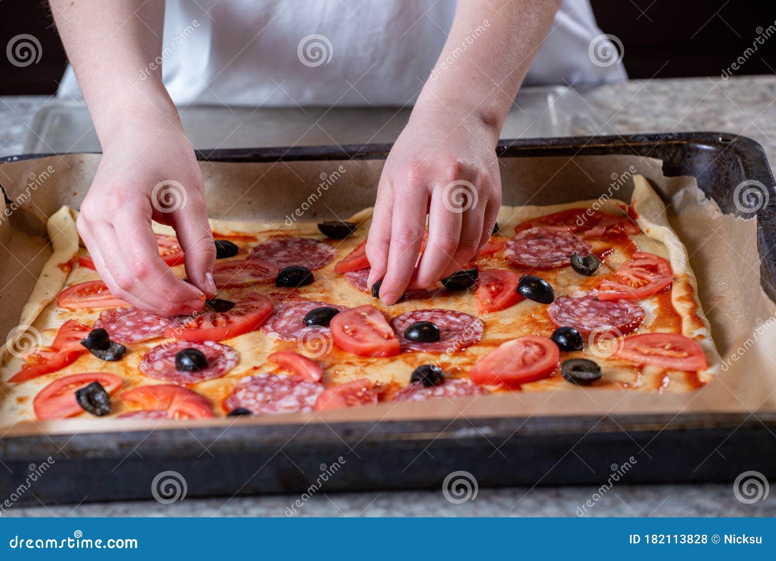 Girl making pizza stock photo. Image of bake, ketchup - 182113828