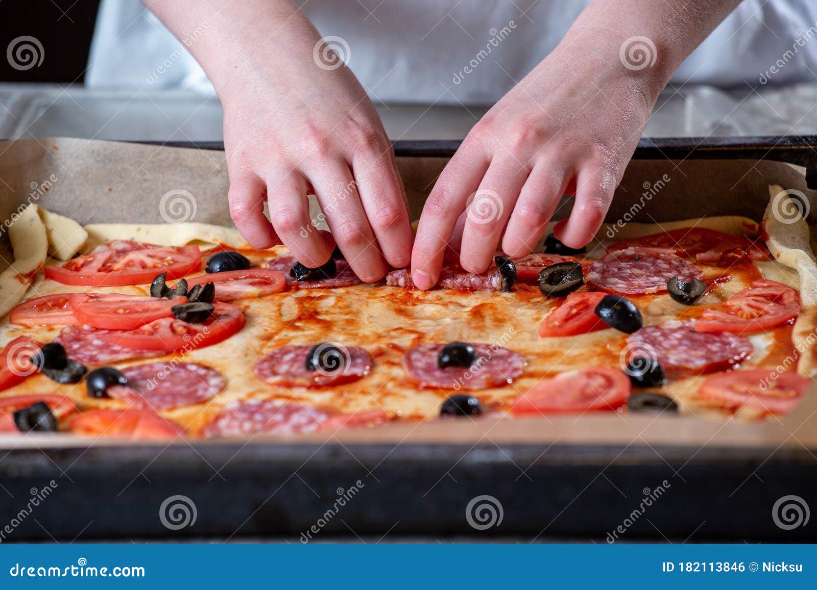 Girl making pizza stock photo. Image of place, bacon - 182113846