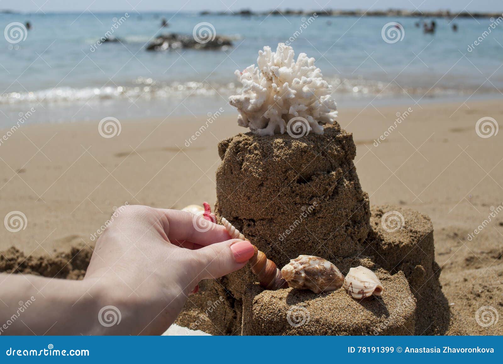 Girl is Making a Sandcastle with Coral on Sandy Beach Stock Image ...