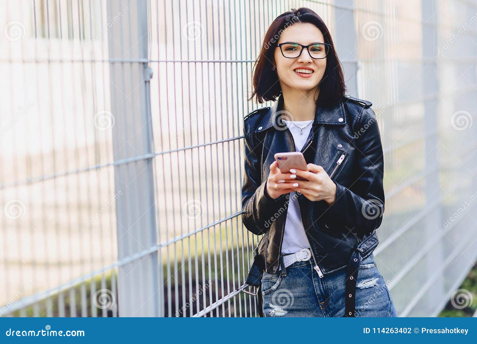 Girl Messaging on Phone and Smiling Stock Photo - Image of sharing ...