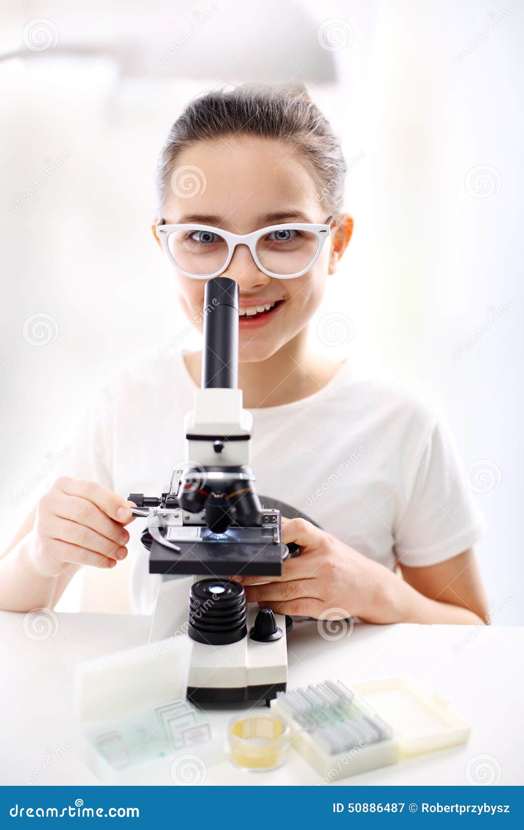 Girl with a microscope stock image. Image of child, cells - 50886487