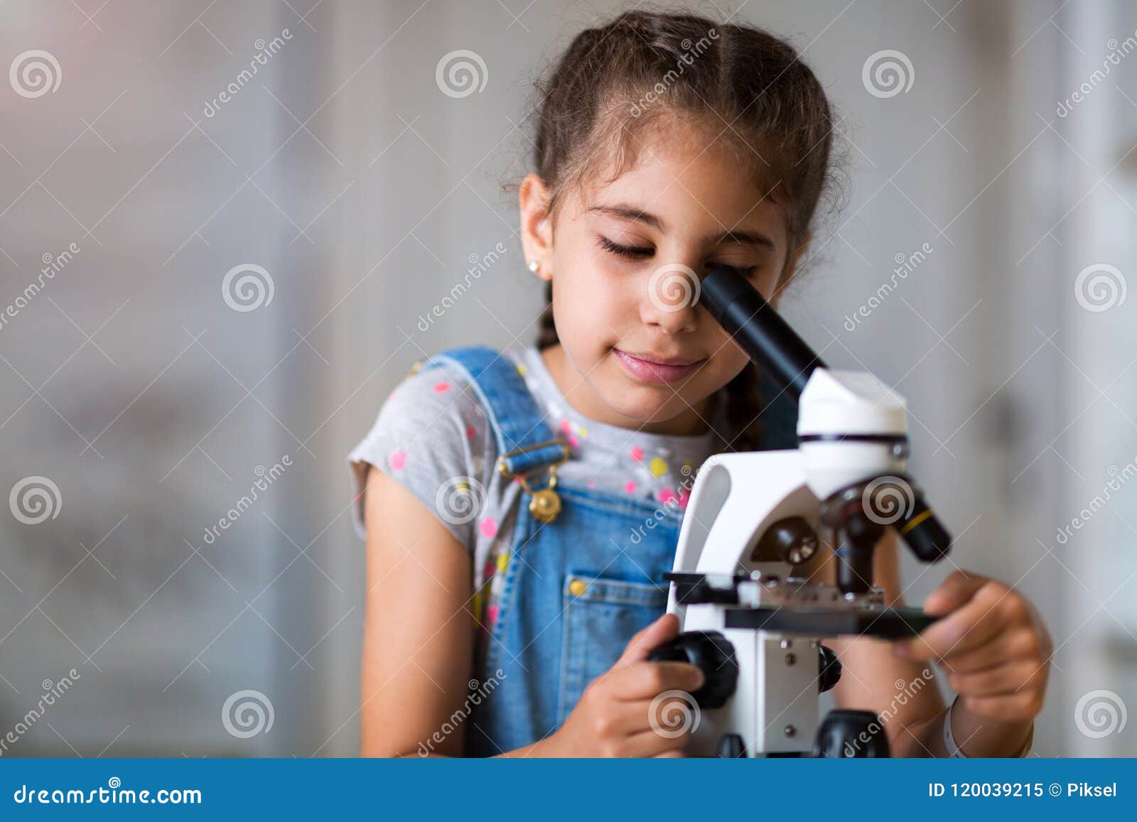 Girl with microscope stock image. Image of concentration - 120039215