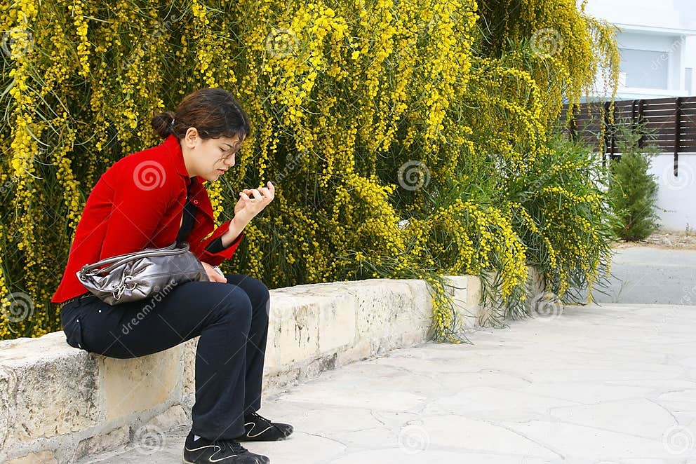 Girl at the mimosa tree stock image. Image of teenage - 12124717