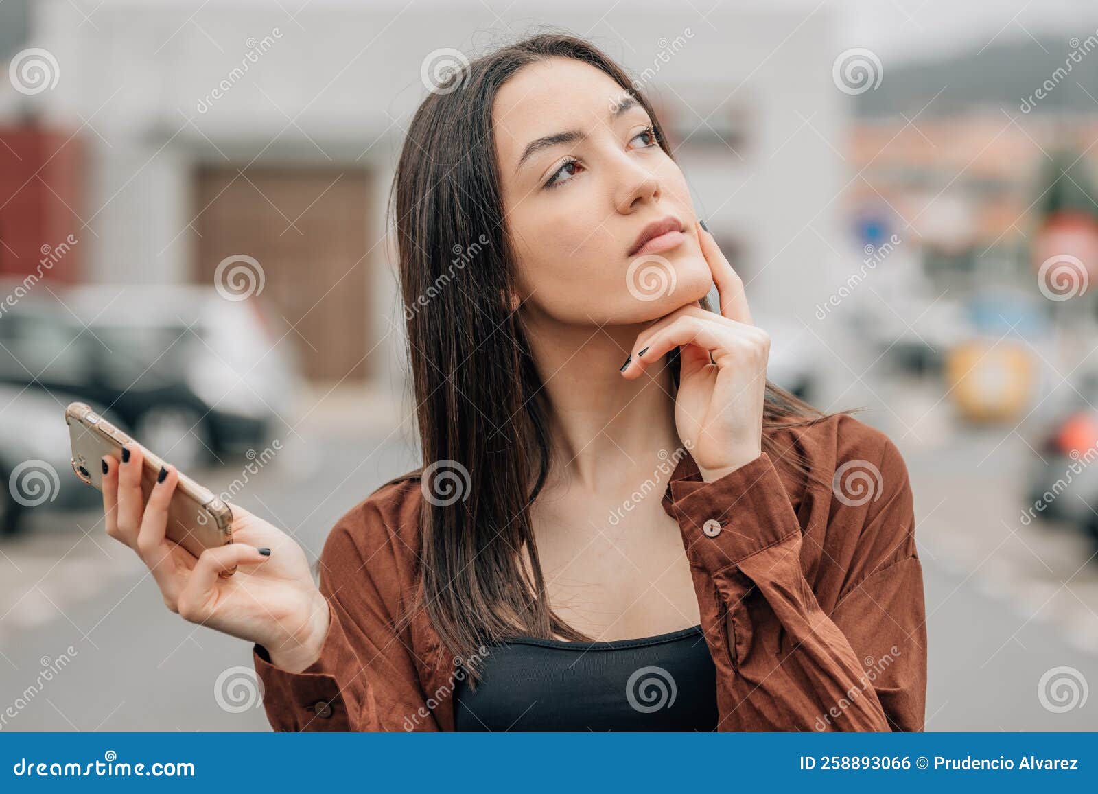 Girl with Mobile Phone with Expression of Thinking Stock Photo - Image ...