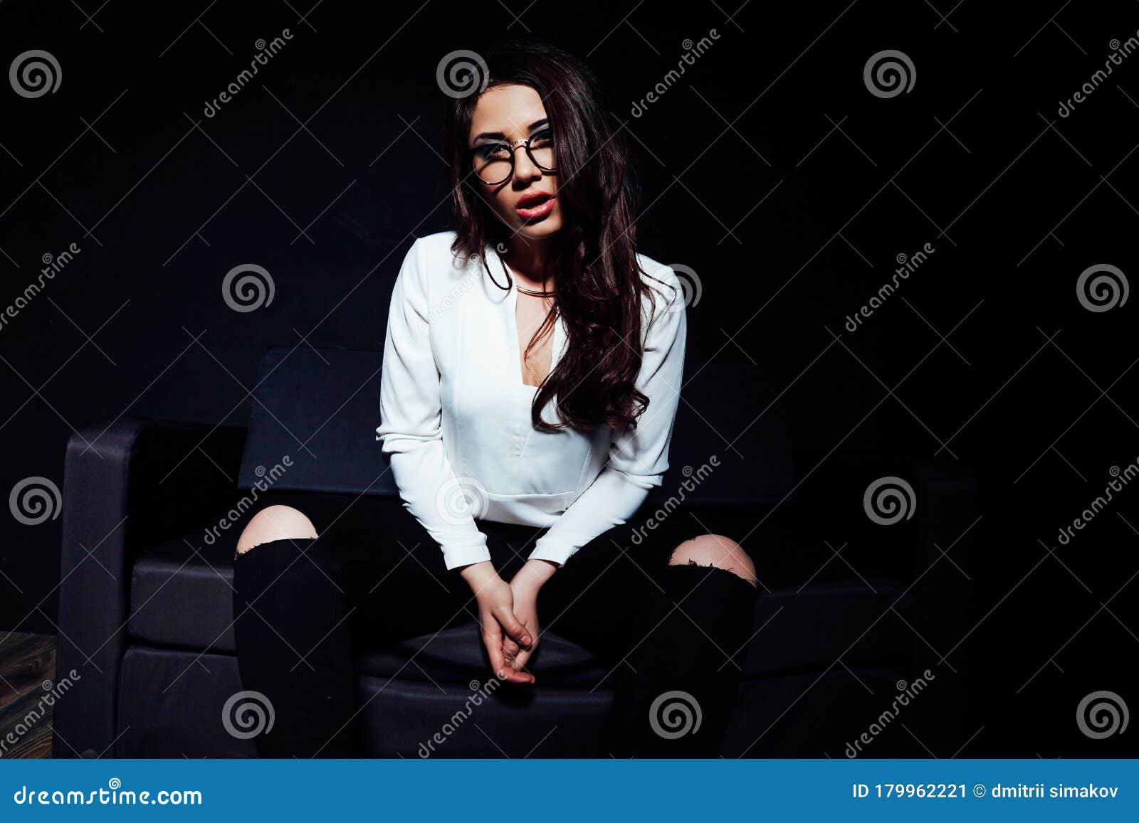 Girl Model Posing in the Studio on a Black Background Stock Image ...