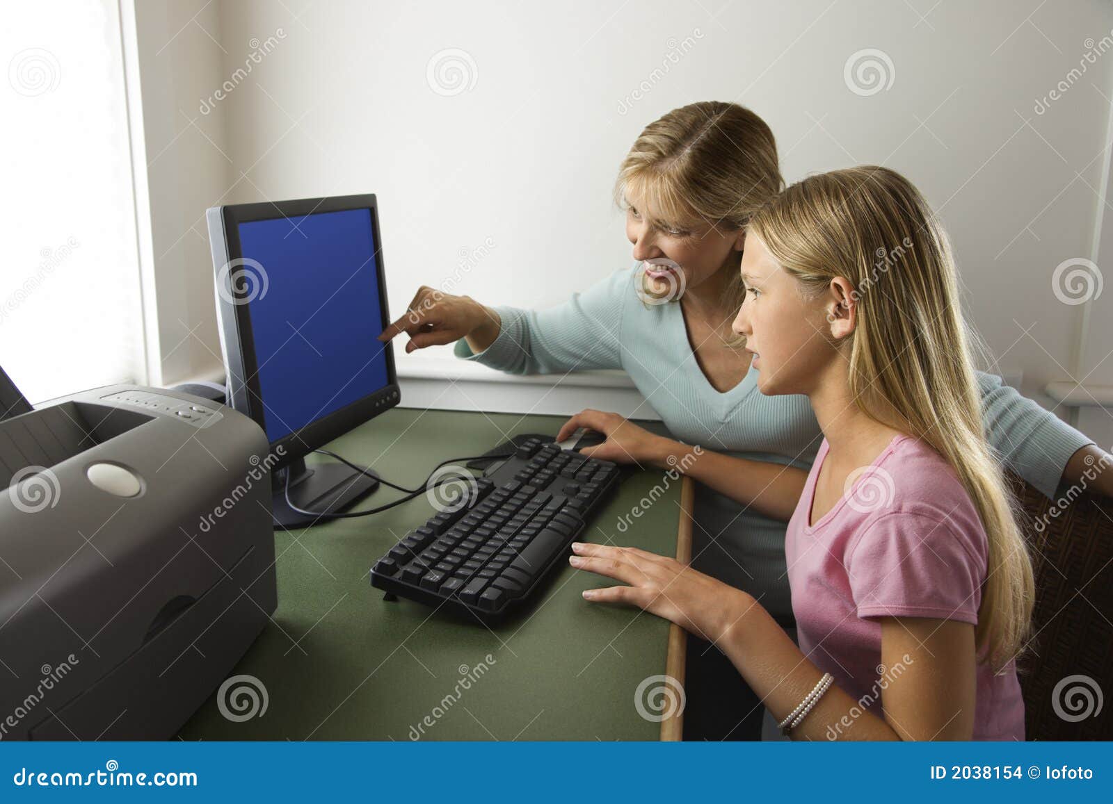 Girl and mom on computer. stock photo. Image of woman - 2038154