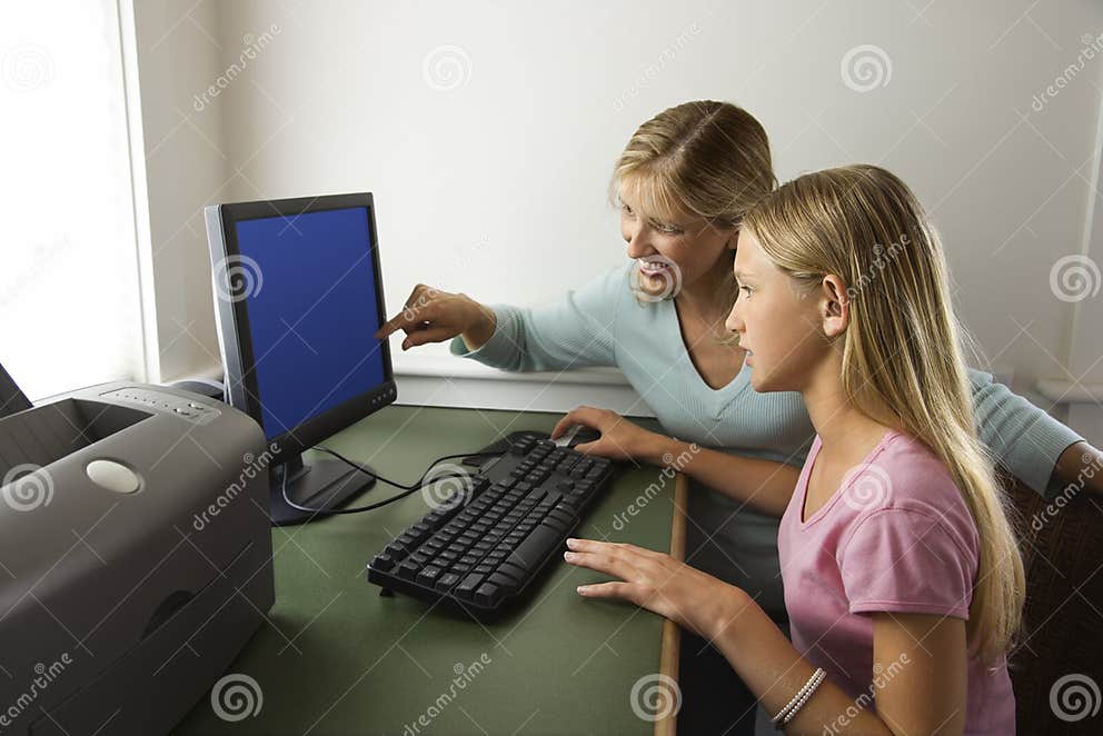 Girl and mom on computer. stock photo. Image of woman - 2038154