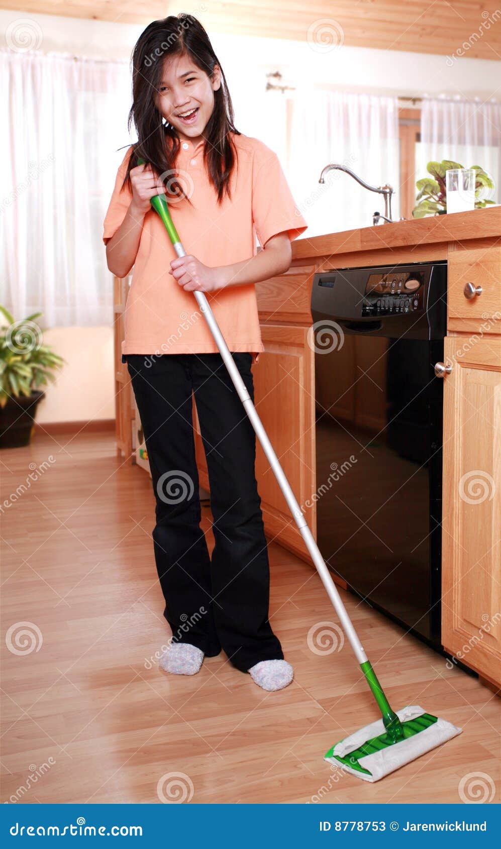 Girl mopping kitchen floor stock image. Image of home - 8778753