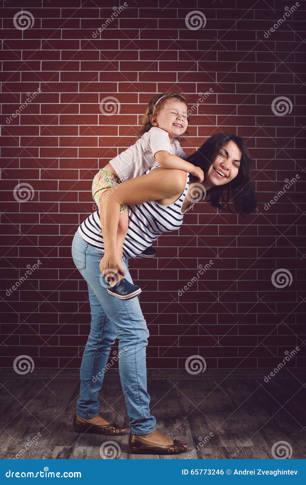 Girl on Mother s Back stock photo. Image of assistance - 65773246