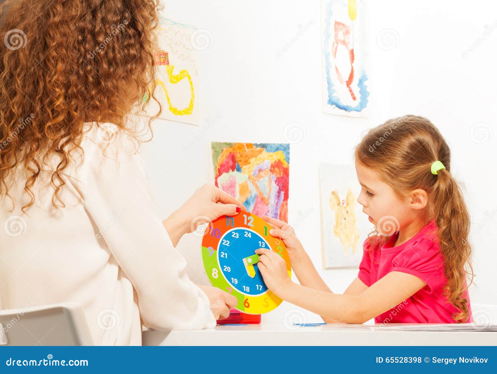 Girl Moving Pointers at the Dial of Clock Model Stock Photo - Image of ...
