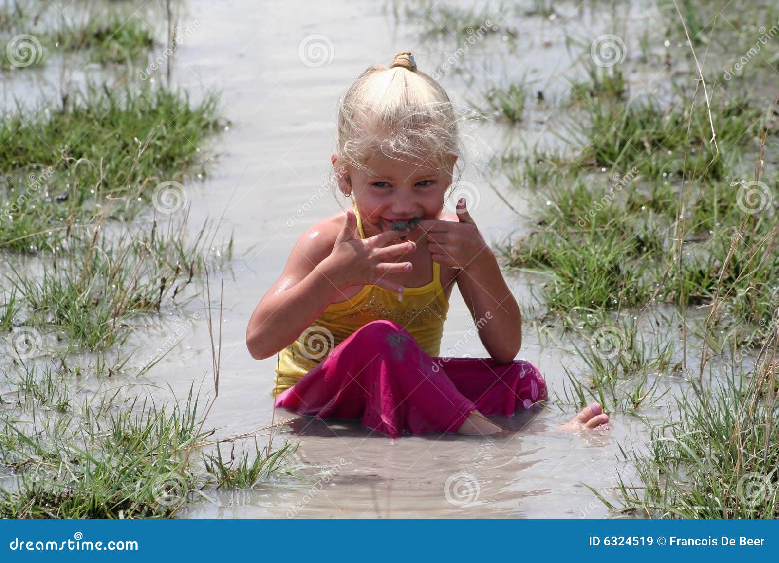 Girl in muddy water stock image. Image of outdoor, feet - 6324519
