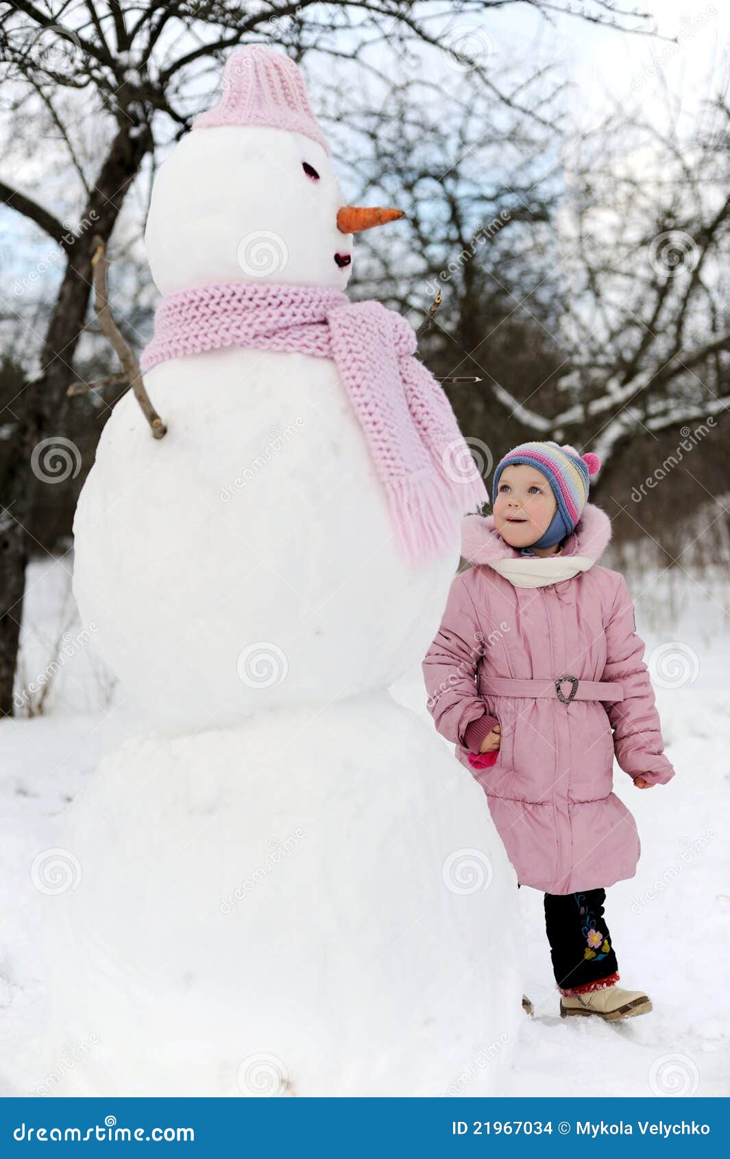Girl near snowman stock photo. Image of outdoors, person - 21967034