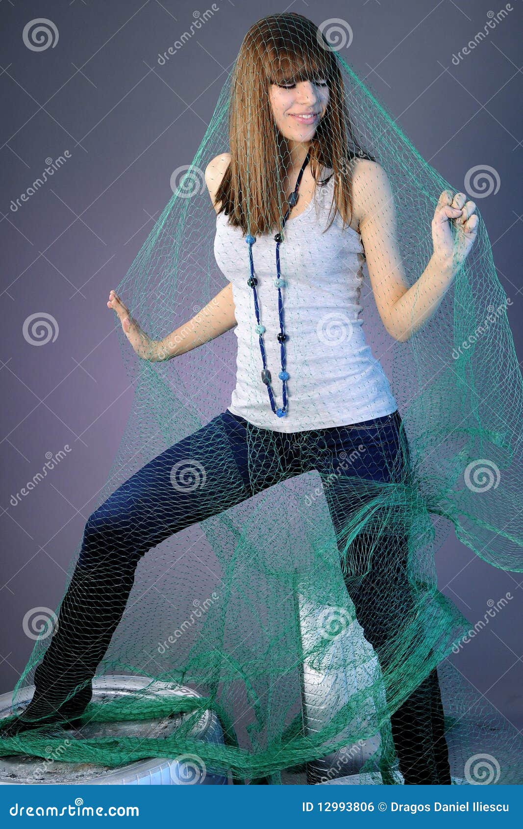 Girl in Netting Posing on Tyres Stock Photo - Image of model, inside ...