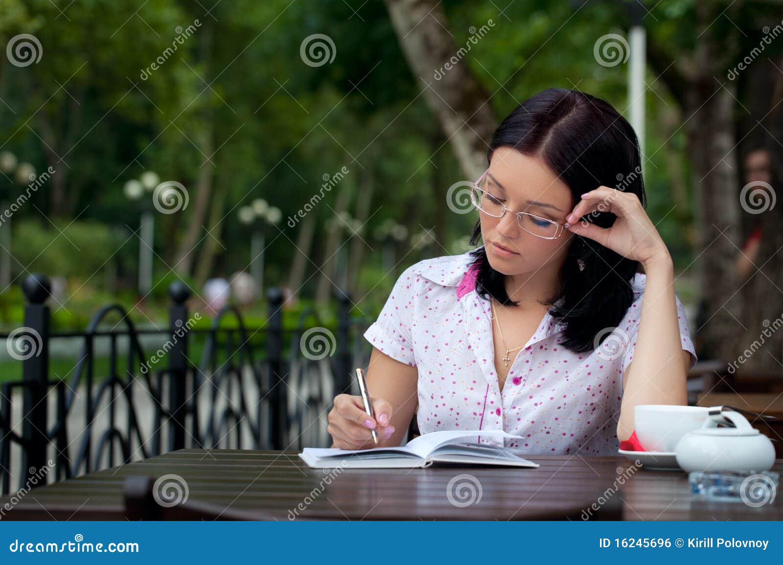 Girl with notepad in cafe stock photo. Image of beauty - 16245696