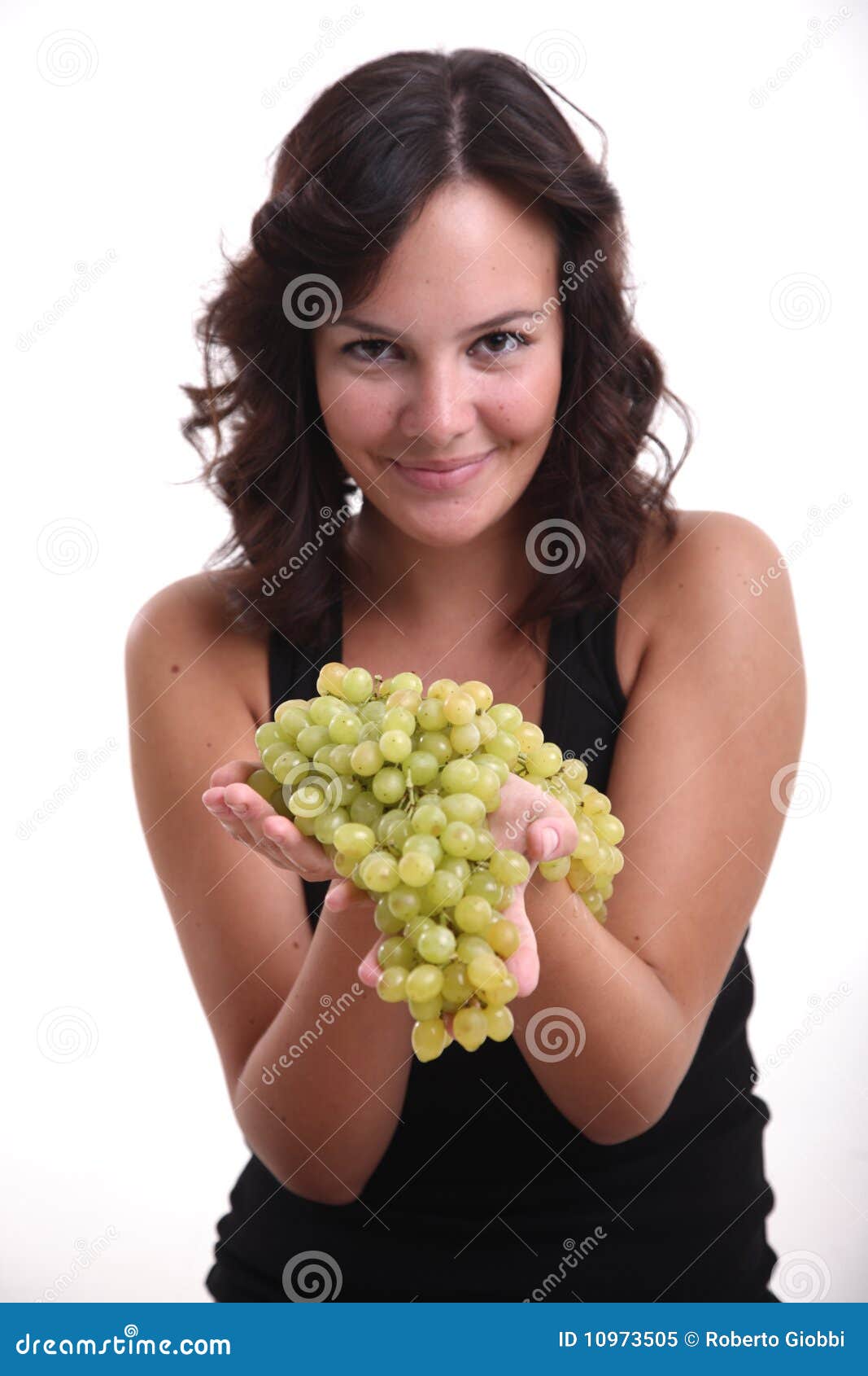 Girl offering grapes stock image. Image of food, white - 10973505