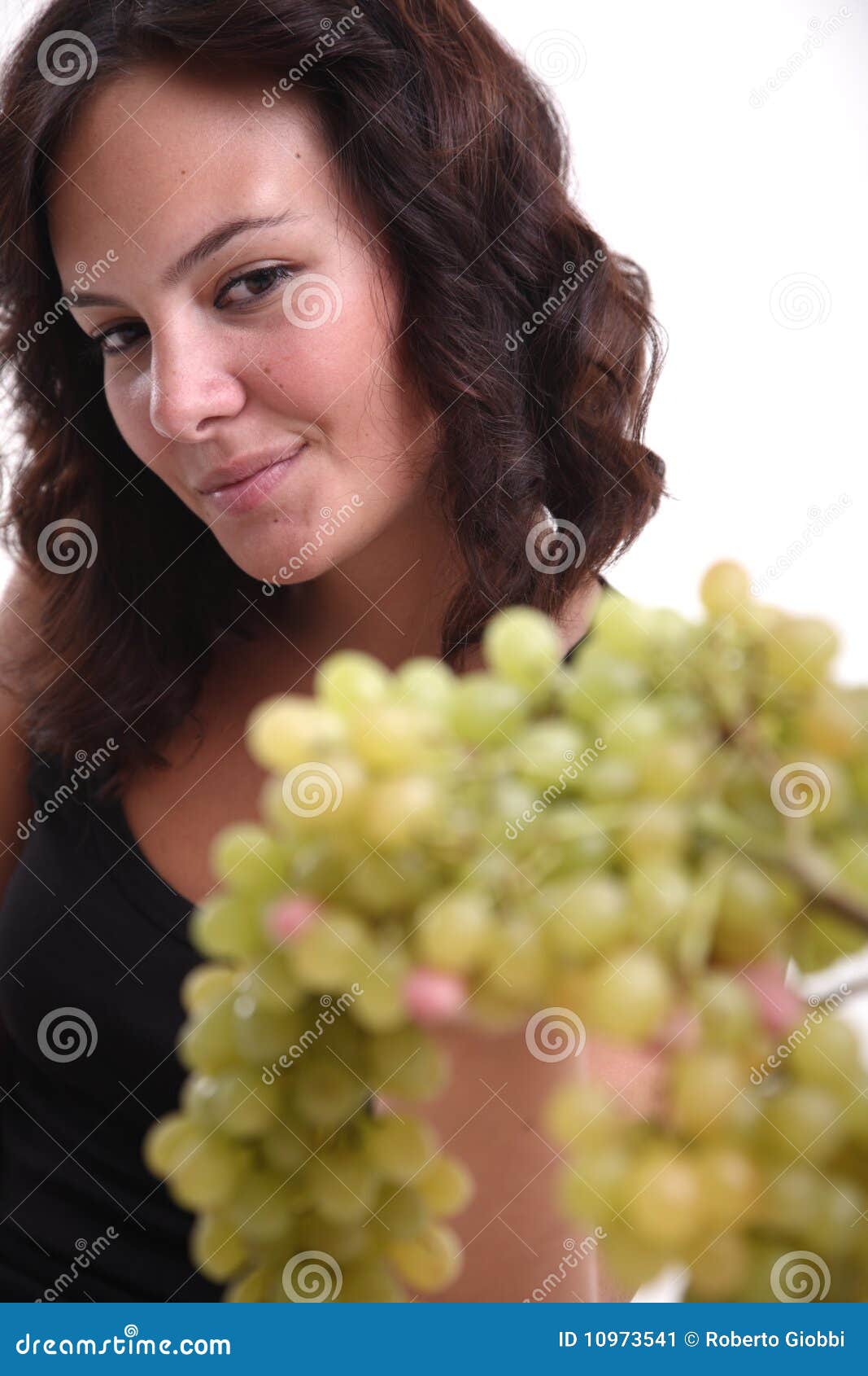 Girl offering grapes stock image. Image of background - 10973541