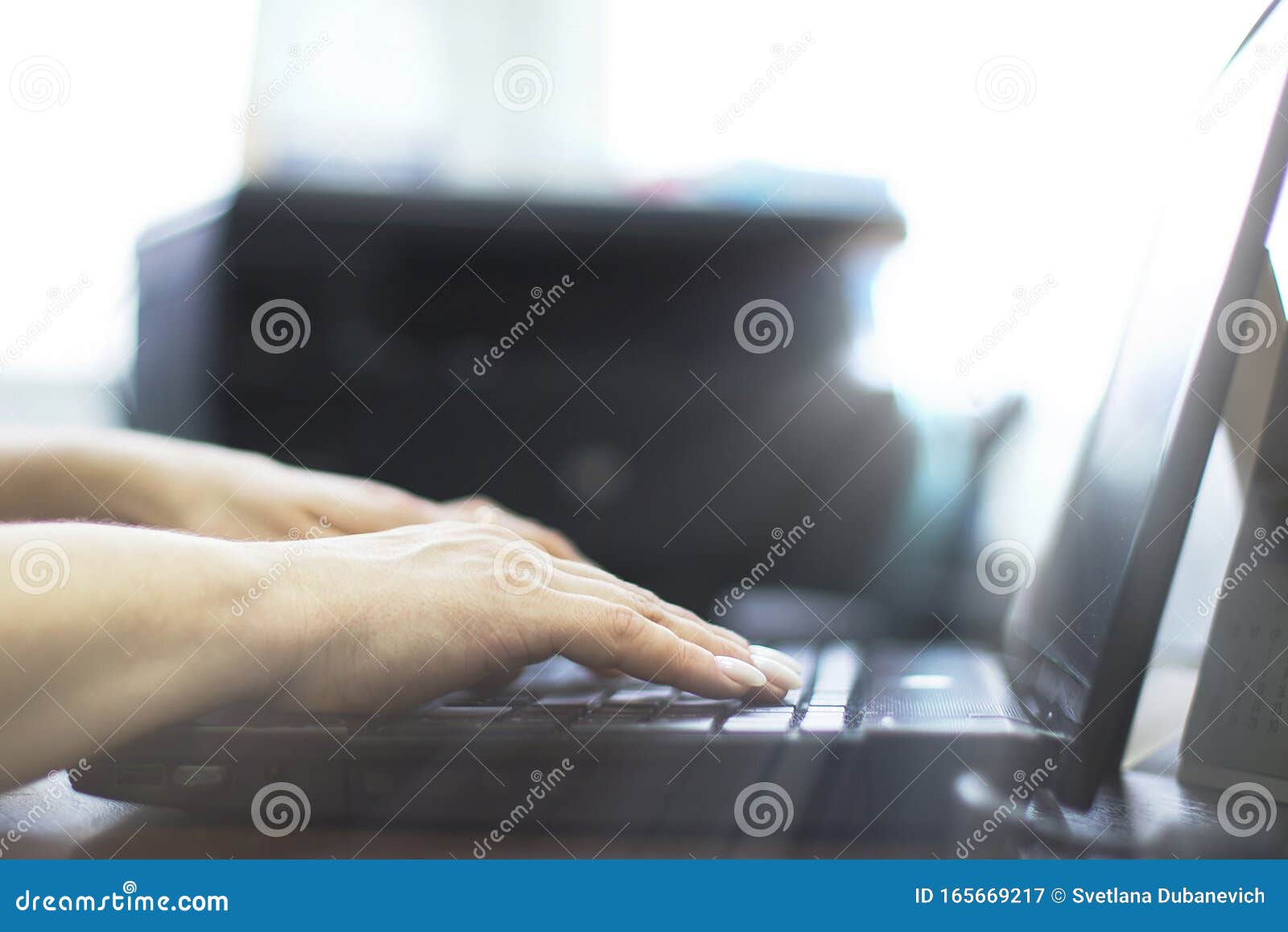 Girl in the Office is Typing on a Laptop. Girl at Work Stock Image ...
