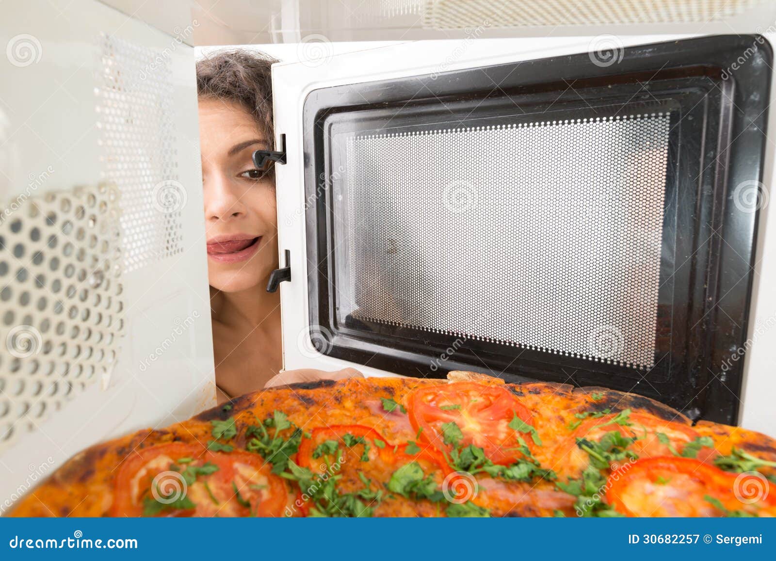 Girl open a microwave stock image. Image of female, curly - 30682257