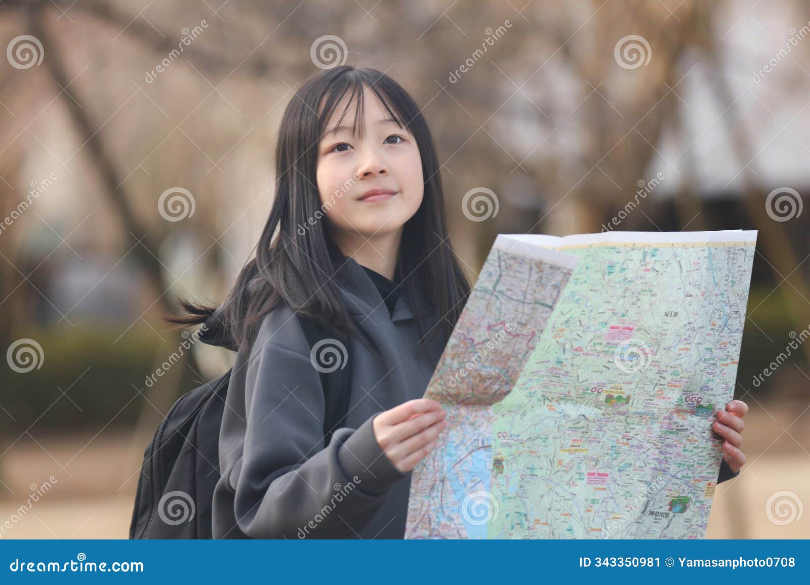 Girl opening a map stock image. Image of study, hobby - 343350981