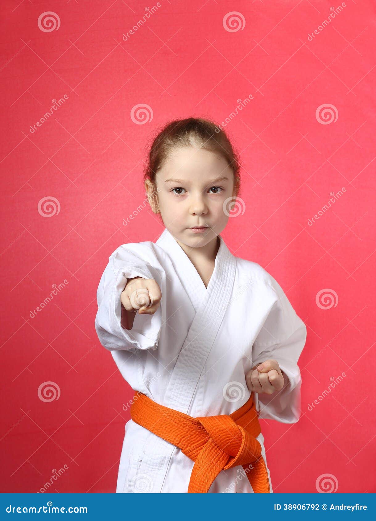 Girl with an Orange Belt is Hitting Right Hand Stock Photo - Image of ...