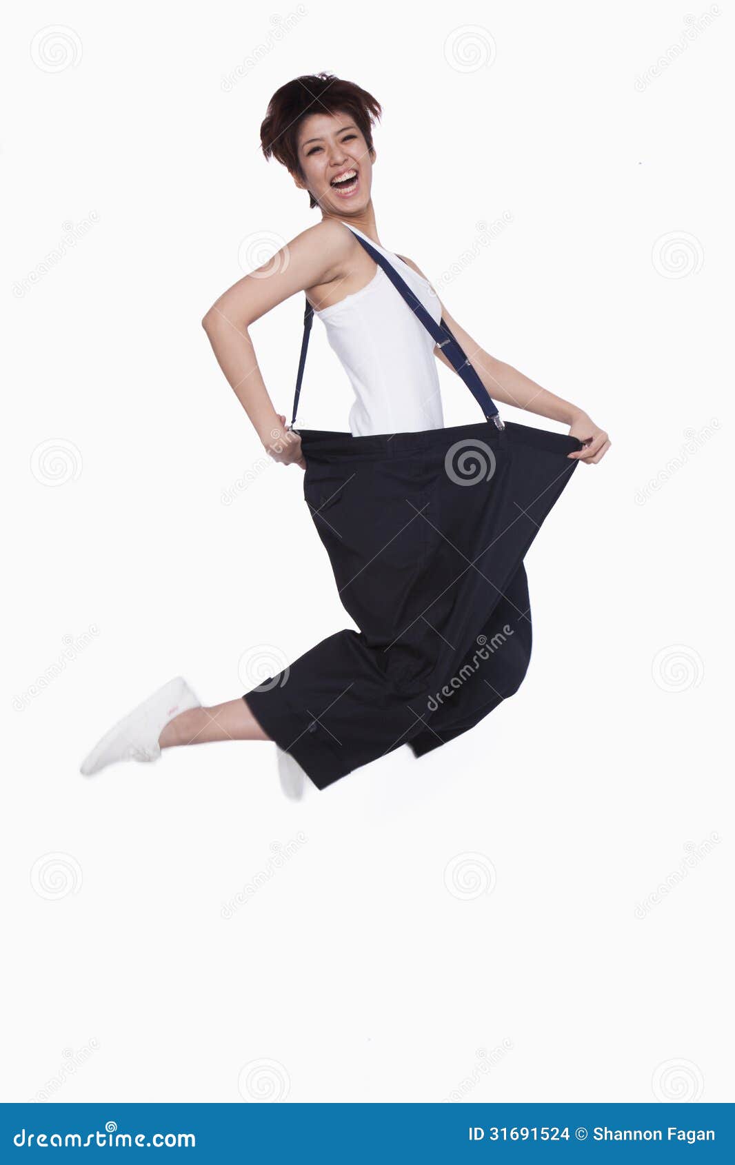 Girl in Oversized Pants Jumping Stock Photo - Image of oversized ...