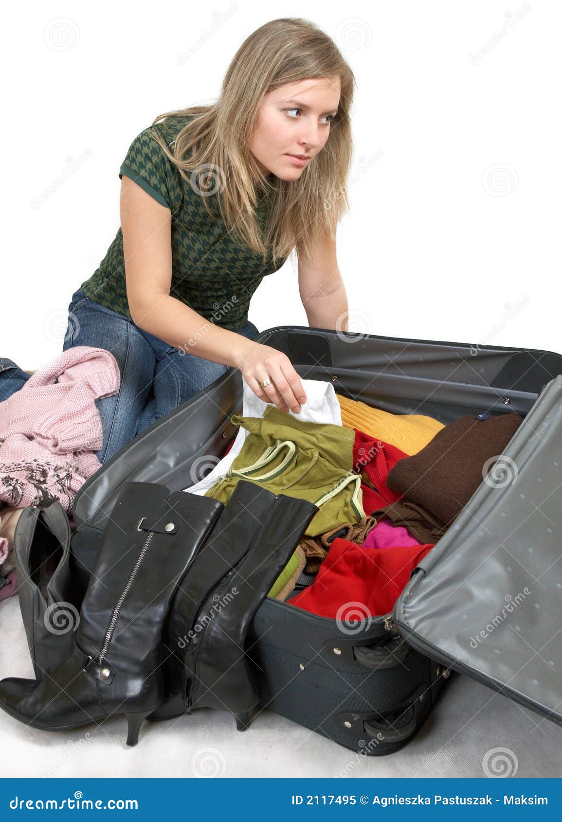Girl is packing clothes stock image. Image of beauty, dress - 2117495