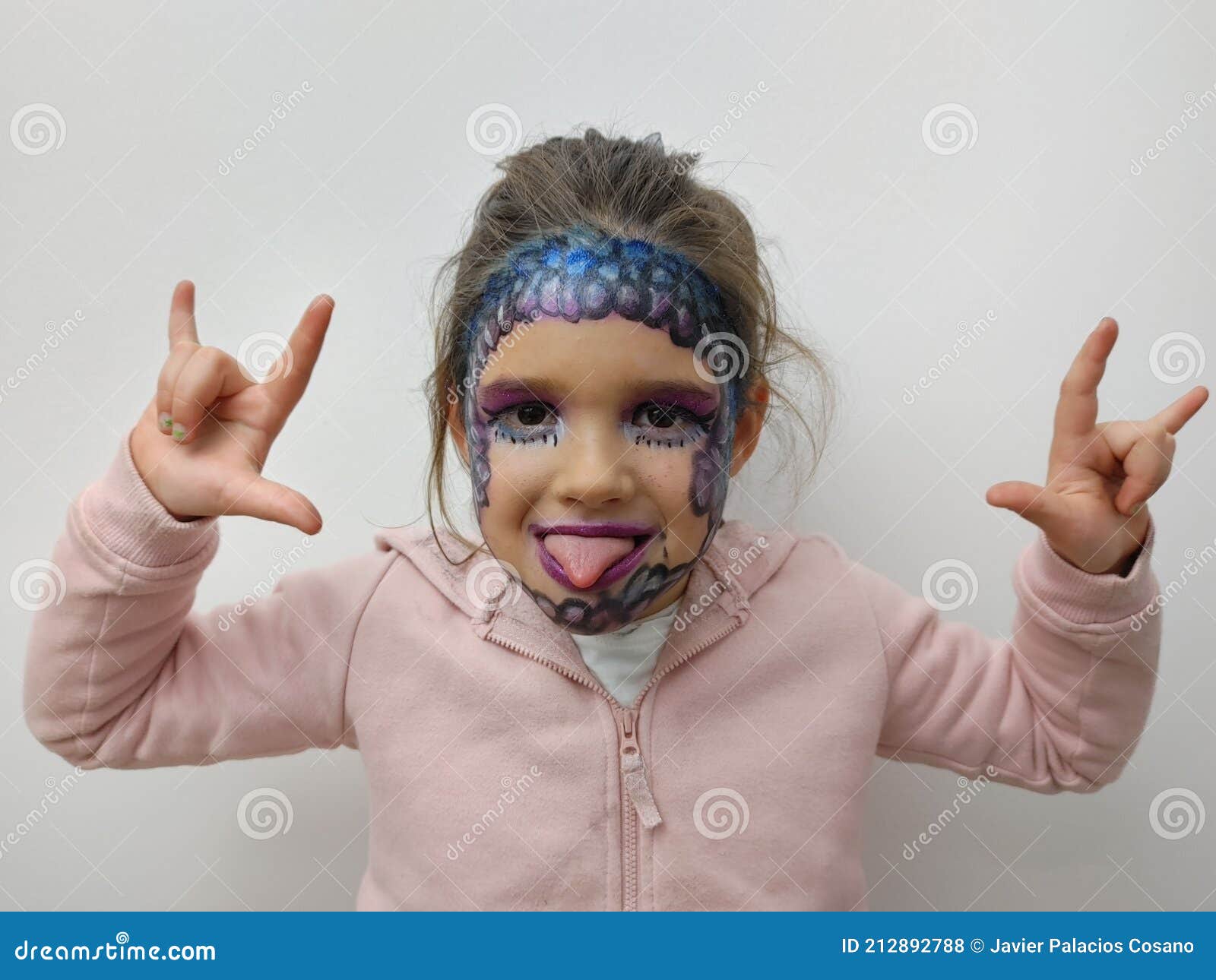 Girl with Painted Face Making Rocker Gesture Stock Photo - Image of ...