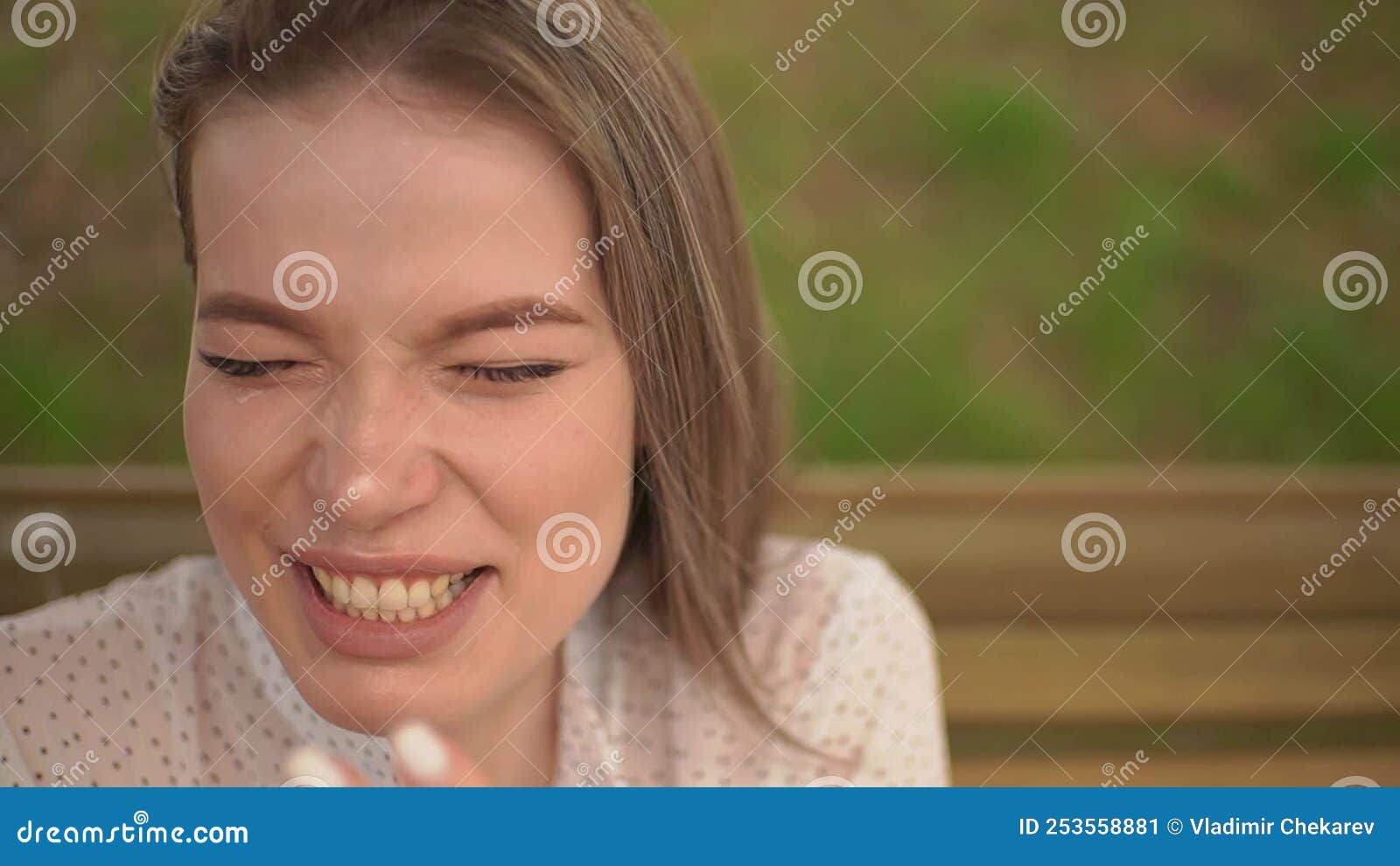 A girl in the park cries stock video. Video of emotional - 253558881