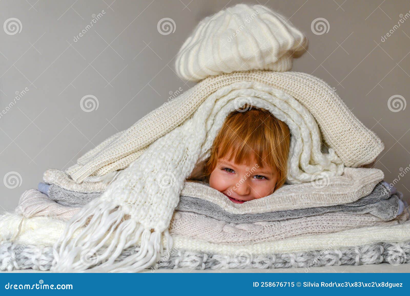 Girl Peeks Out From Behind The Wardrobe Stock Image