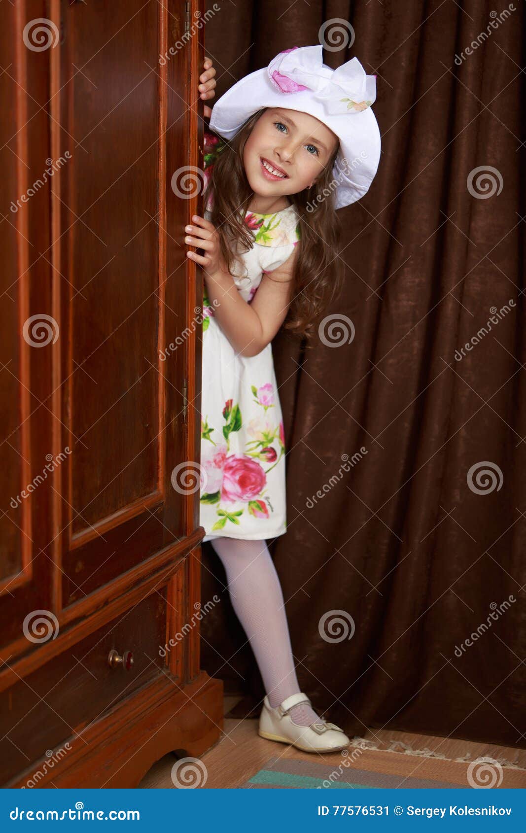 The Girl Peeks Out From Behind The Wardrobe Stock Image Image Of