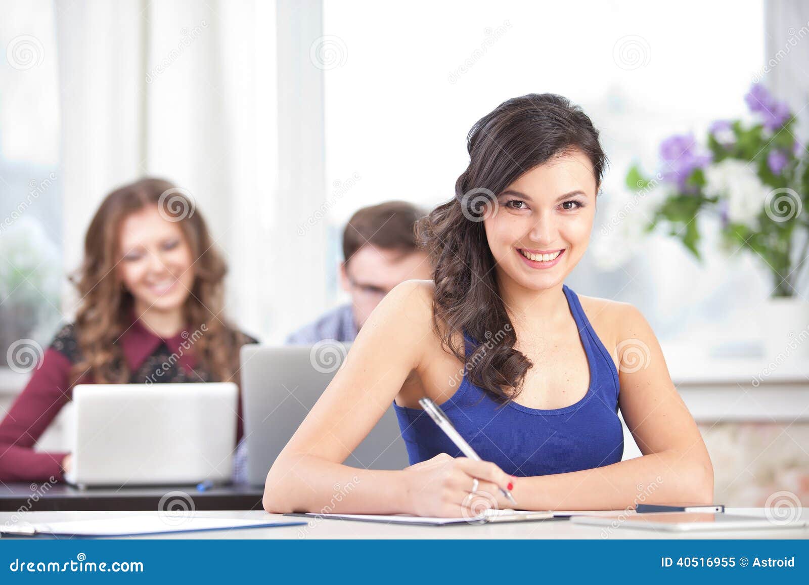 Girl with pen at classroom stock image. Image of backpack - 40516955