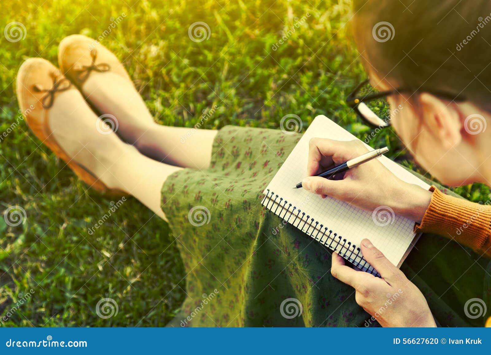 Girl with pen writing stock photo. Image of grass, nature - 56627620