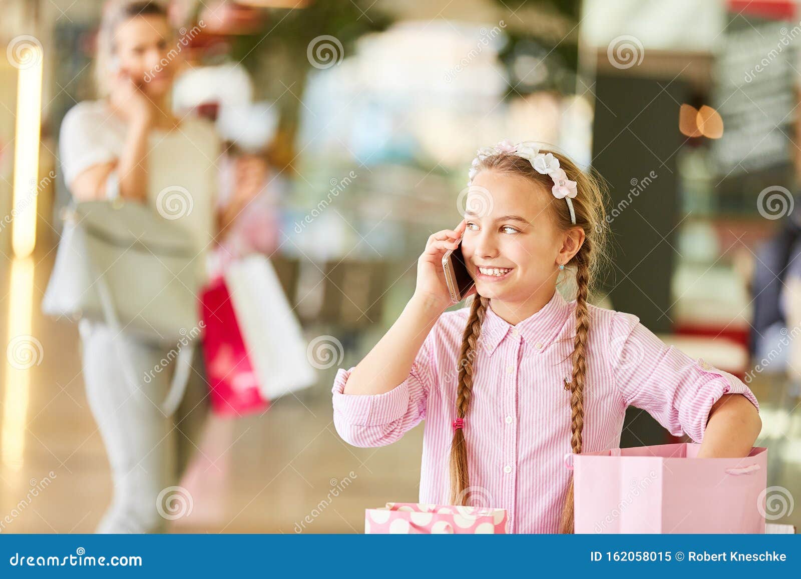 Girl is on the Phone while Shopping Stock Image - Image of mobile ...