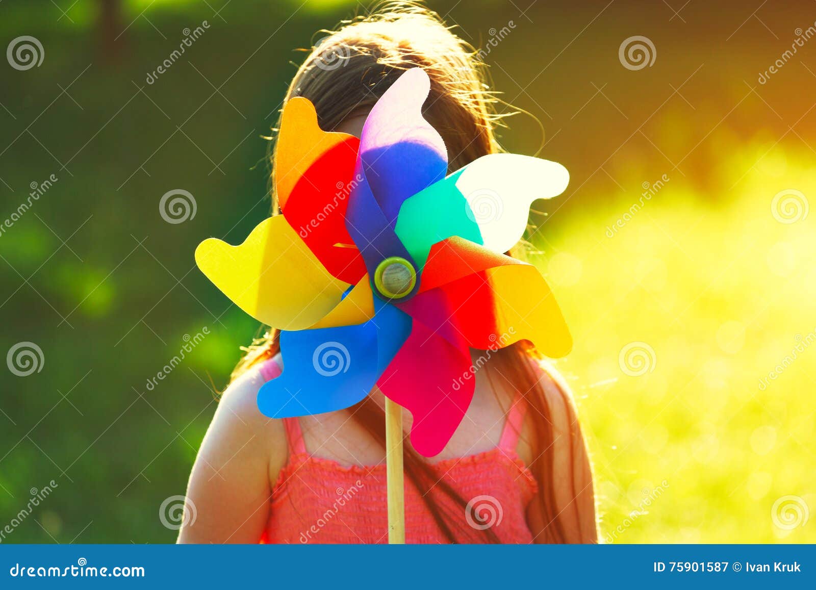 Girl with pinwheel toy stock image. Image of bright, junior - 75901587