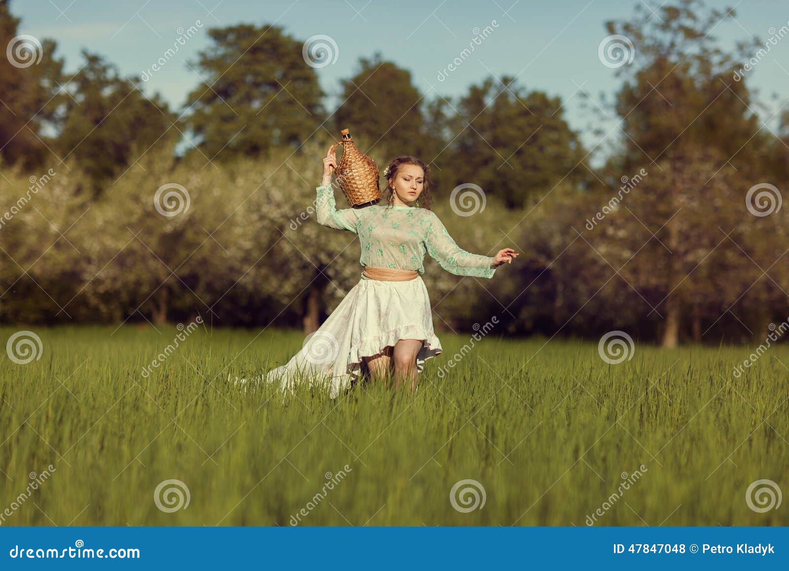 Girl with a Pitcher is on the Field with Grass. Stock Photo - Image of ...