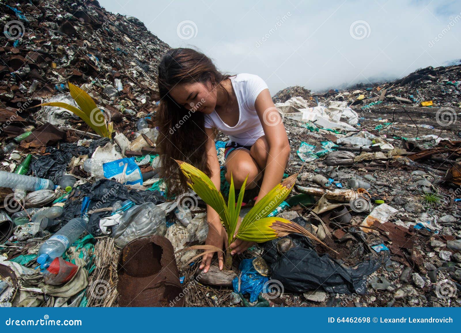 Girl Planting Tree among Trash at Garbage Dump Stock Photo - Image of ...