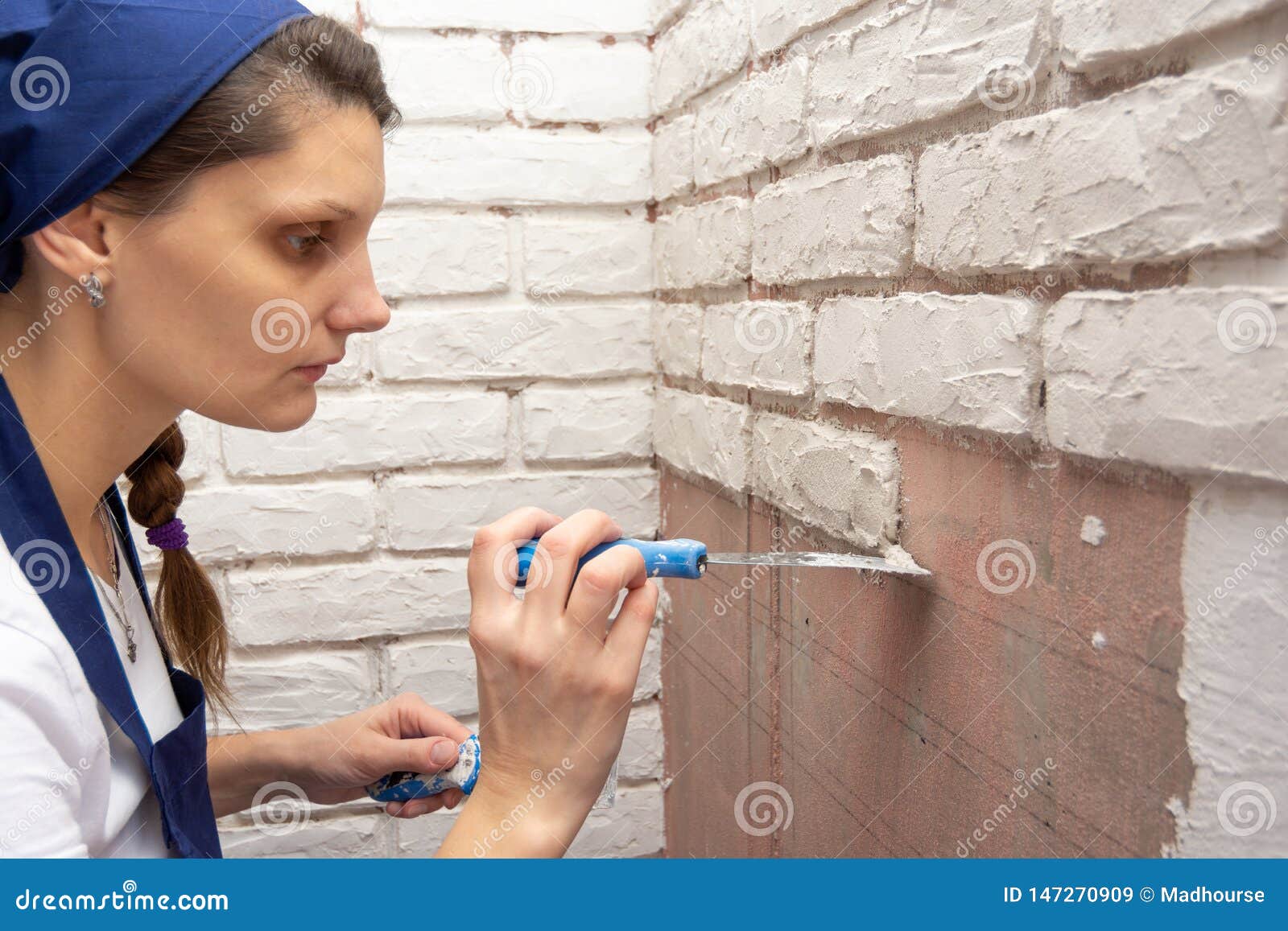 Girl Plasterer Lays on the Wall with Plaster Imitation Brickwork Stock ...