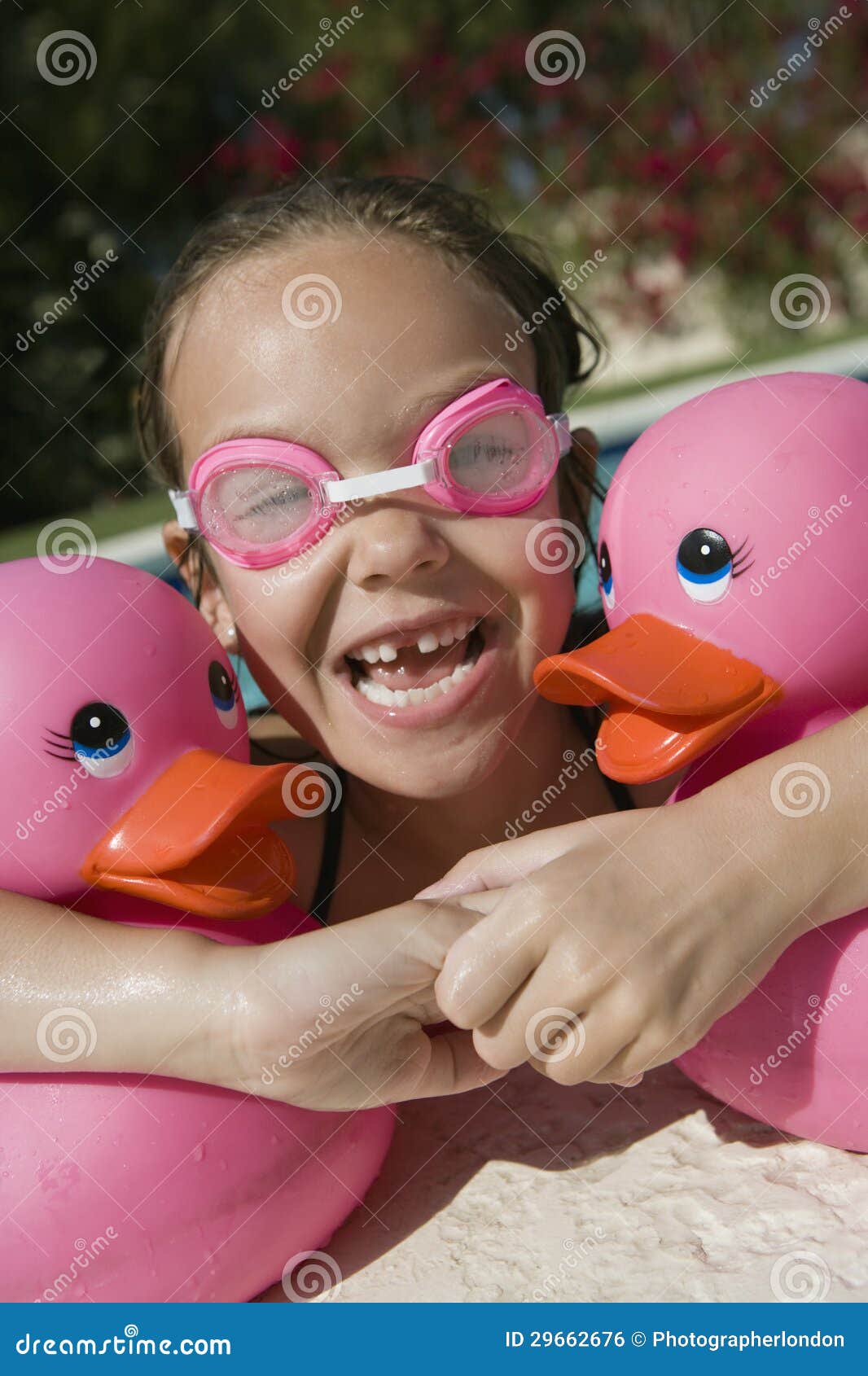 Girl with Plastic Ducks Relaxing on the Edge of Pool Stock Photo ...