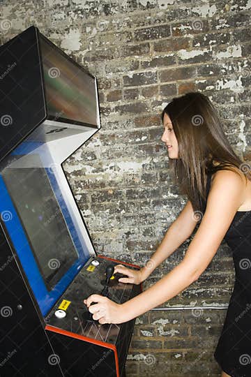 Girl Playing an Arcade Game Stock Image - Image of competition, arcade ...