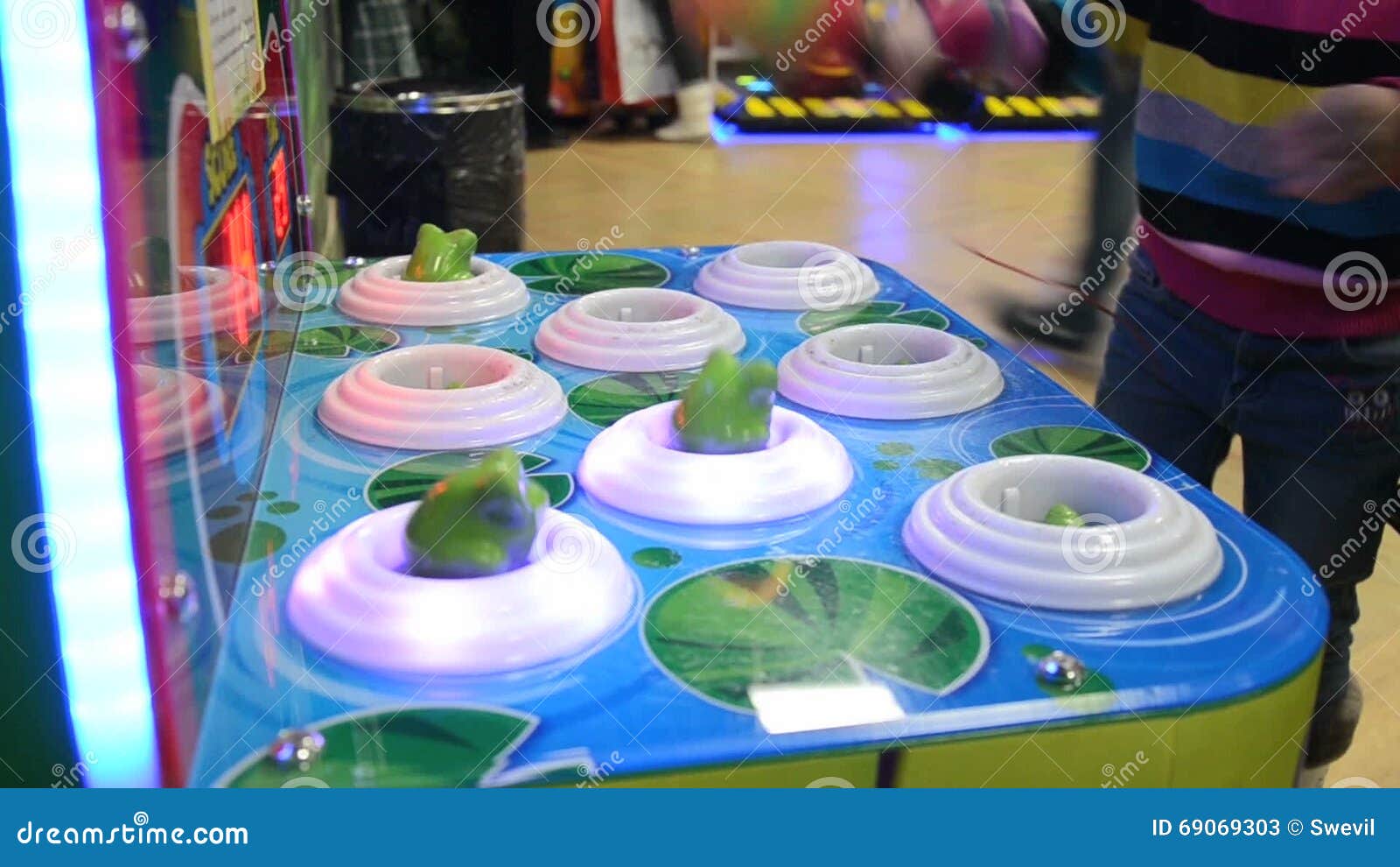 Girl Playing Arcade Game Machine at an Amusement Park Stock Video ...