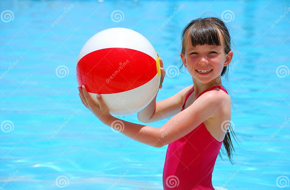 Girl Playing with Ball in Pool Stock Photo - Image of water, smiling ...